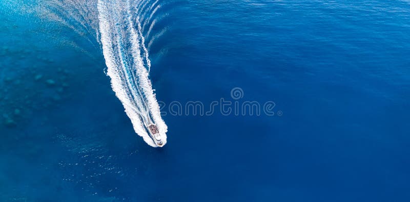Aerial Drone View of a Speedboat Running on a Blue Water Stock Photo ...