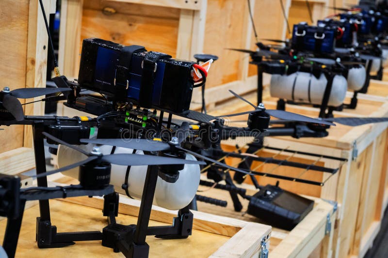 Aerial Drones with Camera Systems Arrayed in a Row Ready for Flight ...