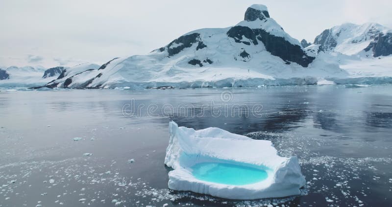 Aerial Flight Over Melting Iceberg in Antarctica Stock Video - Video of ... Aerial Flight Over Melting Iceberg in Antarctica Stock Video - Video of ...