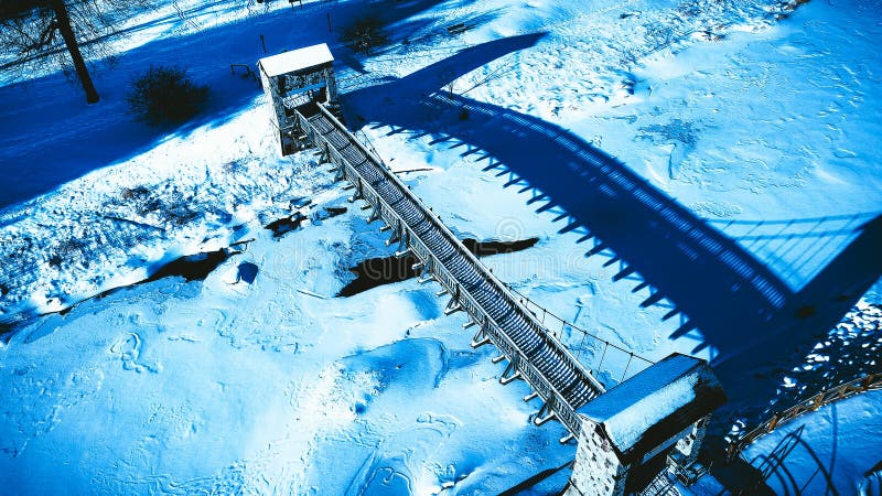 Aerial of Frozen Bridge Over River at Park Stock Photo - Image of ...