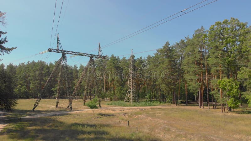 Aerial High-angle 4K View of a High Voltage Power Line with a Powerful ...