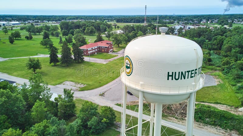 Aerial of Huntertown Water Tower Utility with Abandoned Brick Building ...