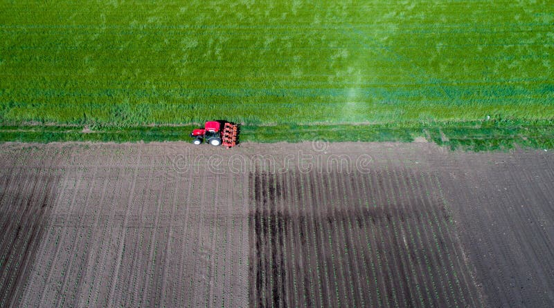 Tractor Working in Field in Spring Stock Image - Image of cultivation ...