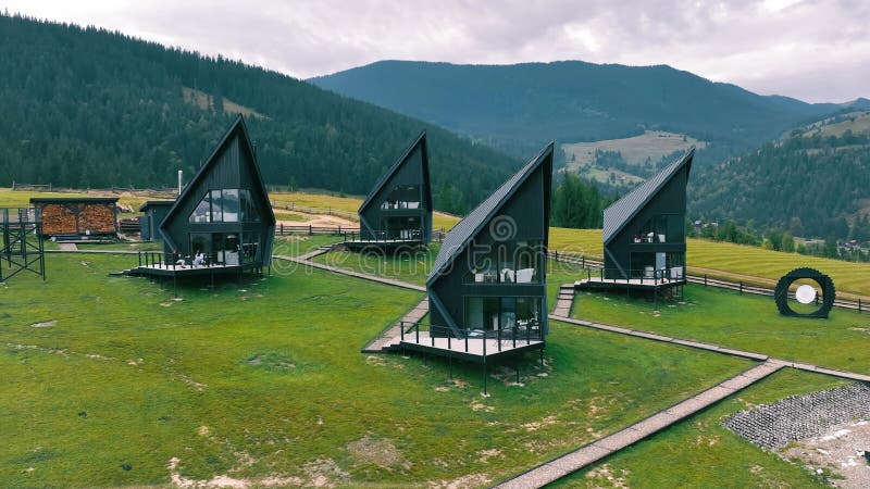 Aerial Modern a-Frame Cabins on Grassy Hillside. a Group of Modern ...