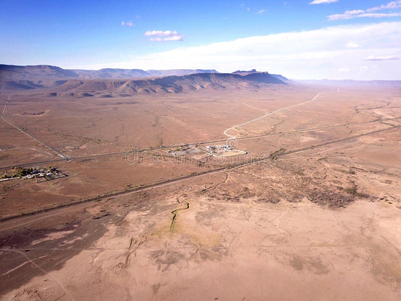Aerial over a desert town stock image. Image of drone - 139318783