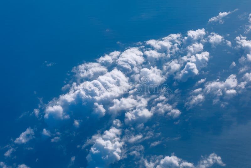 Aerial Perspective of Fluffy Clouds from an Airplane Stock Photo ...