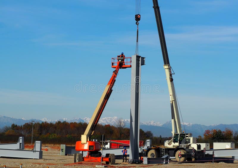 An Aerial Platform with a Mobile Crane Install the First Metal Column ...