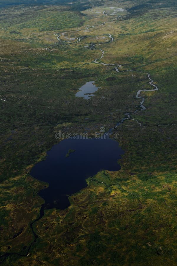 Aerial Point of View of a Big Lake that Flows Down by a River ...