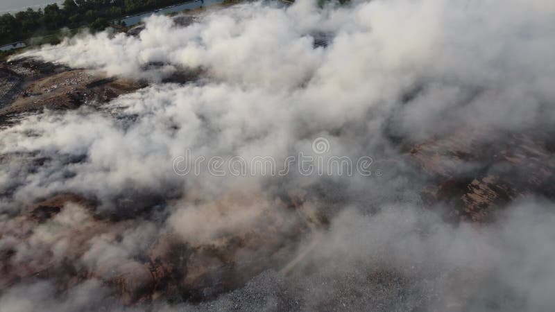 Aerial Pull Back Air Pollution Smoke Release from Fire Burning Stock ...