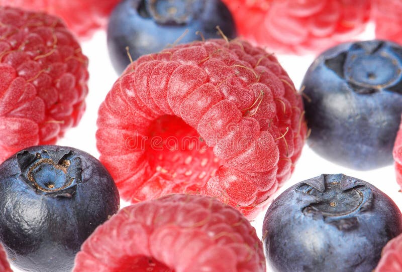 Aerial Red Raspberries and Dark Blue Blueberries on a Light Substrate ...
