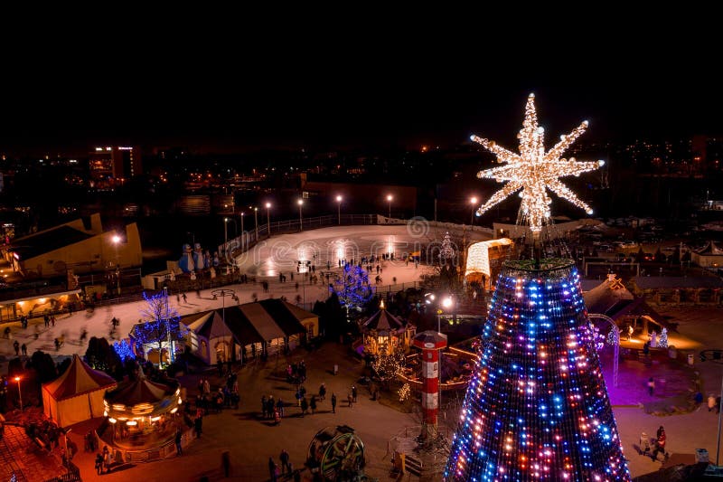 Aerial Shot of Beautiful Illuminated Christmas Tree at Dusk with Led ...