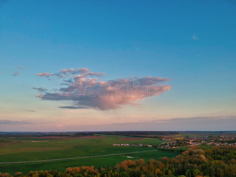 Aerial Shot of a Beautiful Plain on a Sunset Sky Background with a ...