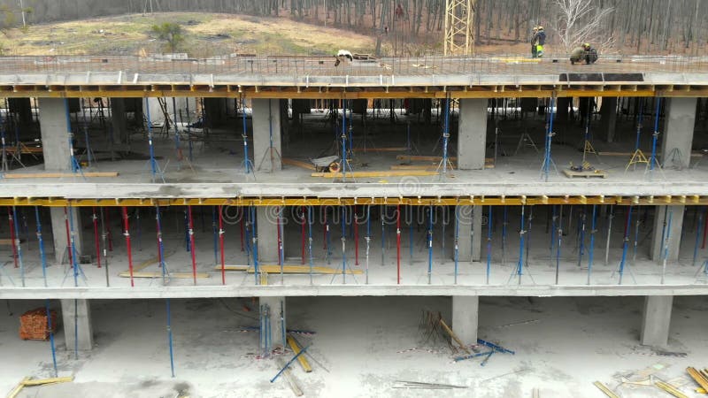 Aerial Shot of the Building in the Process of Construction. Workers ...