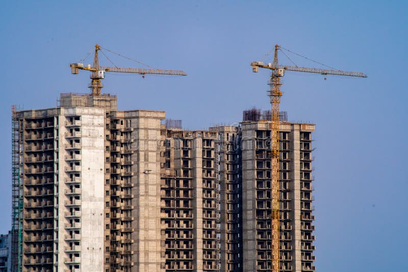 Aerial Shot of Building Under Construction with Crane at the Top Stock ...
