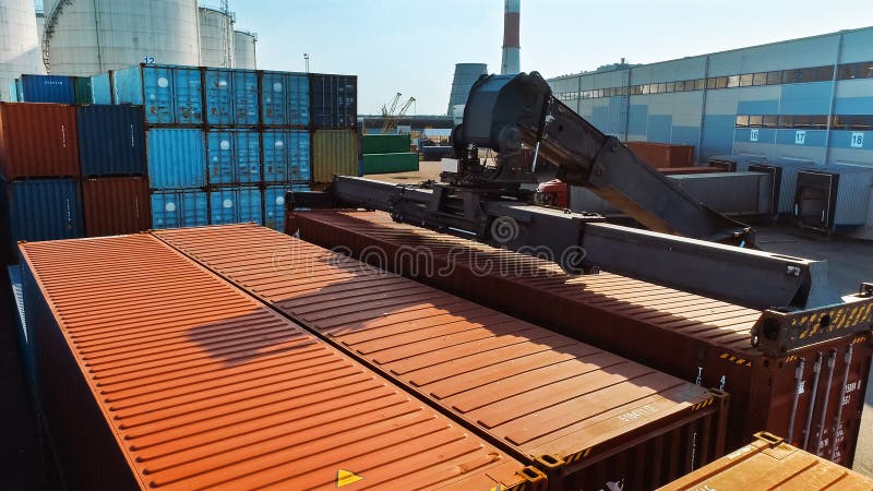 Aerial Shot of a Container Handler Carrying a Large Red Shipping Cargo ...