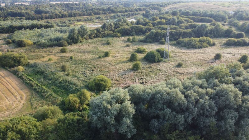 Aerial Shot of an Electricity Pylon in a Field during the Day Stock ...