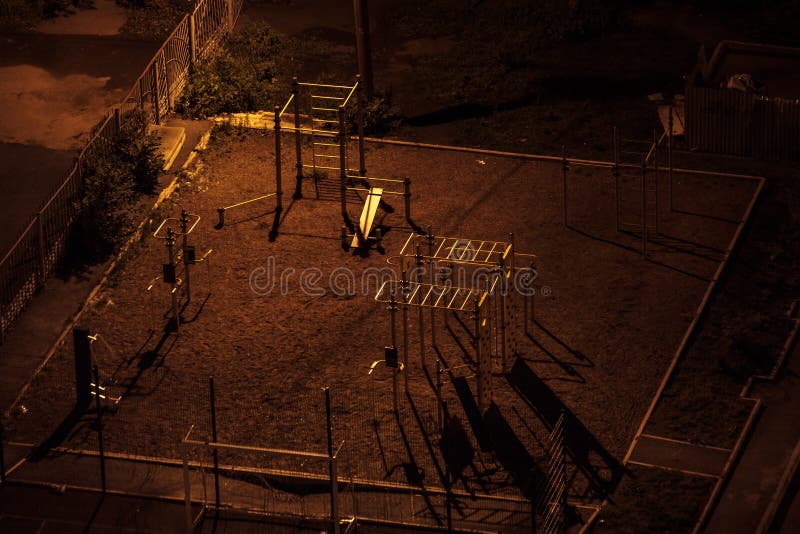 Aerial Shot of an Empty Sport Field at Night in a Dark Yard with Long ...