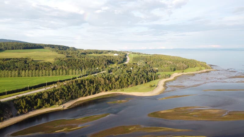 Aerial Shot of the Green Coastline Featuring an Expansive View of the ...