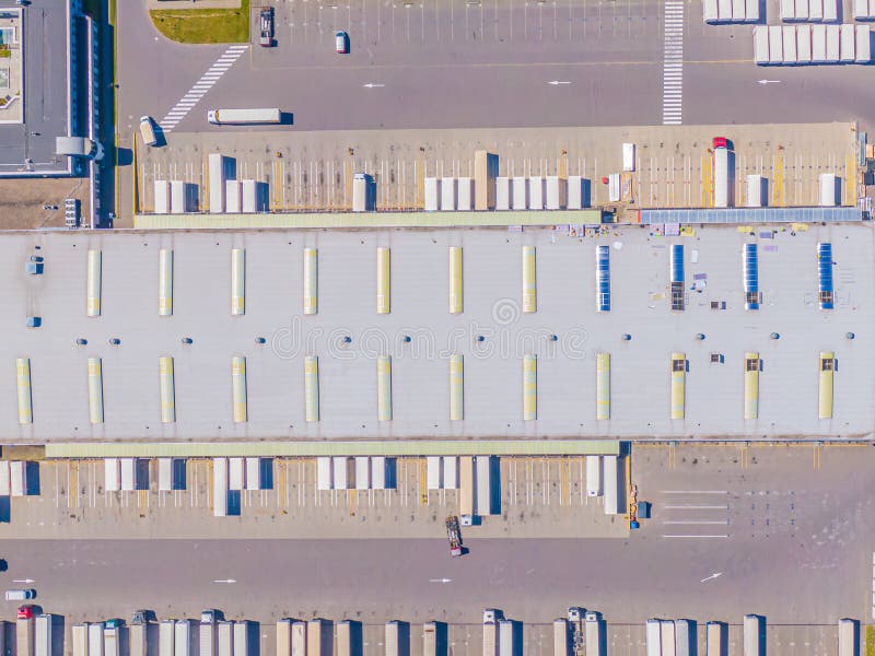 Aerial Shot of Industrial Loading Area Where Many Trucks are Unloading ...