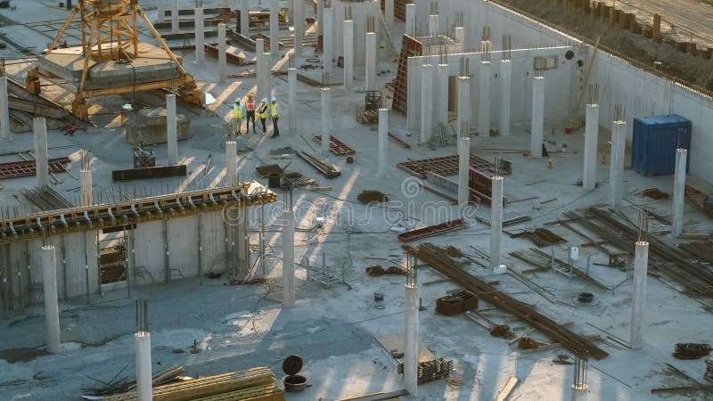 Aerial Shot of a New Constructions Development Site with Diverse Team of Engineers and ...