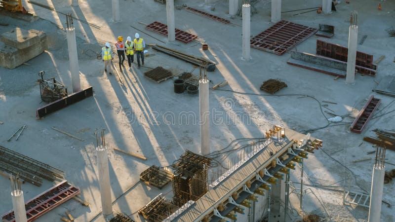 Aerial Shot of a New Constructions Development Site with Diverse Team of Engineers and ...