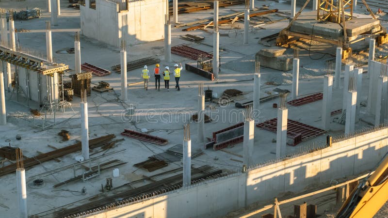 Aerial Shot of a New Constructions Development Site with Diverse Team of Engineers and ...