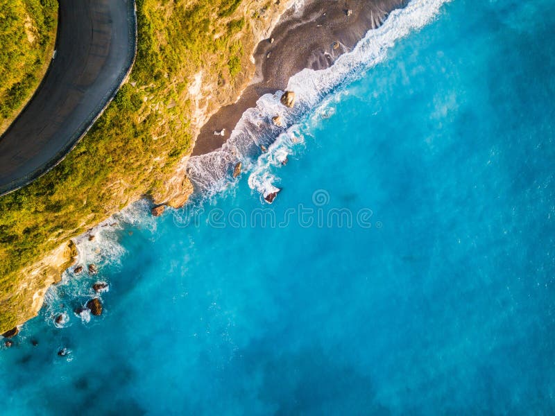 Aerial Shot of Ocean Waves Covering the Coastline Stock Image - Image ...