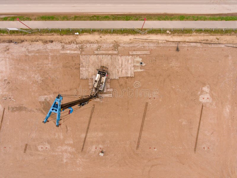 Aerial Shot of a Pile Driver on a Construction Site Stock Photo - Image ...