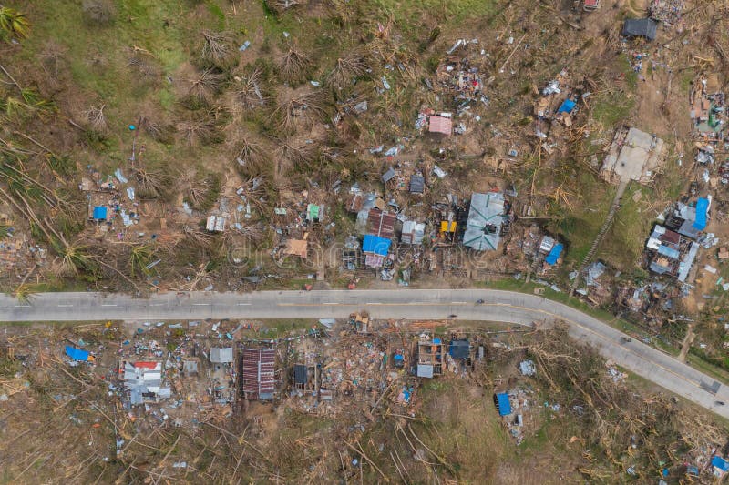 Aerial Shot of a Road in the Middle of Destroyed Buildings on Dry ...