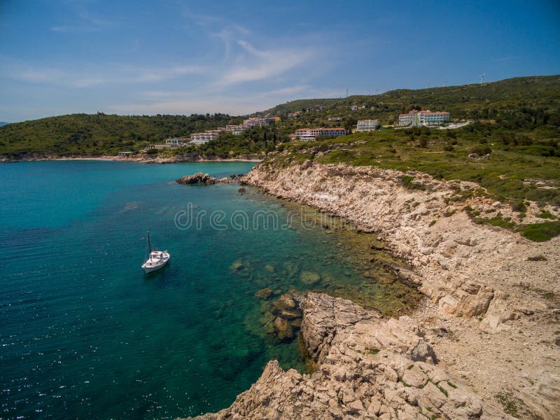Aerial Shot of the Rocky Cliffs and the Beach by the Ocean Captured in ...