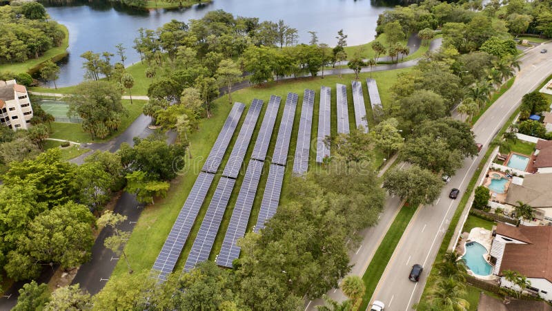Aerial Shot of Solar Panels by a Pond in Florida Stock Photo - Image of ...