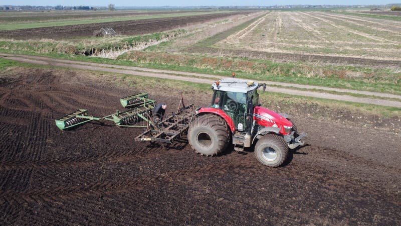 Aerial Shot of a Tractor Working in a Rural Field. Editorial Stock ...