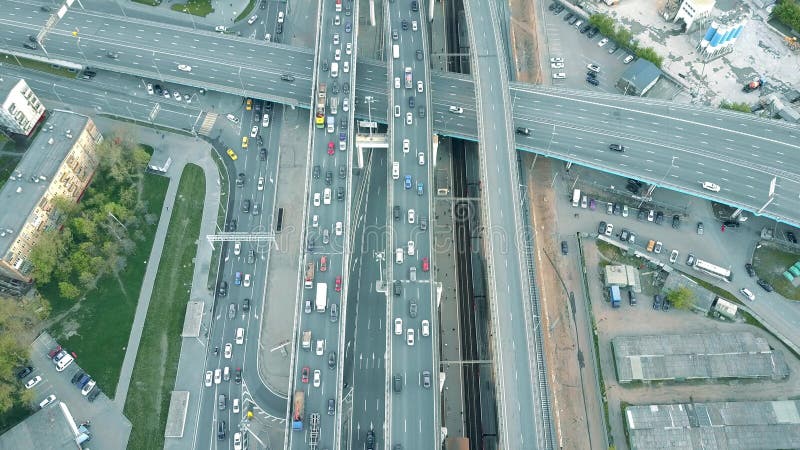 Aerial Shot of Traffic Jam on a Highway and Moving Train in the Rush ...
