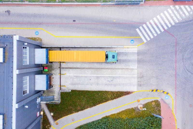 Aerial Side Shot of Industrial Warehouse Loading Dock Where Man Stock ...