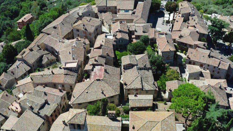 Aerial Slow Movement Around Buildings Surrounded by Trees in Italy ...