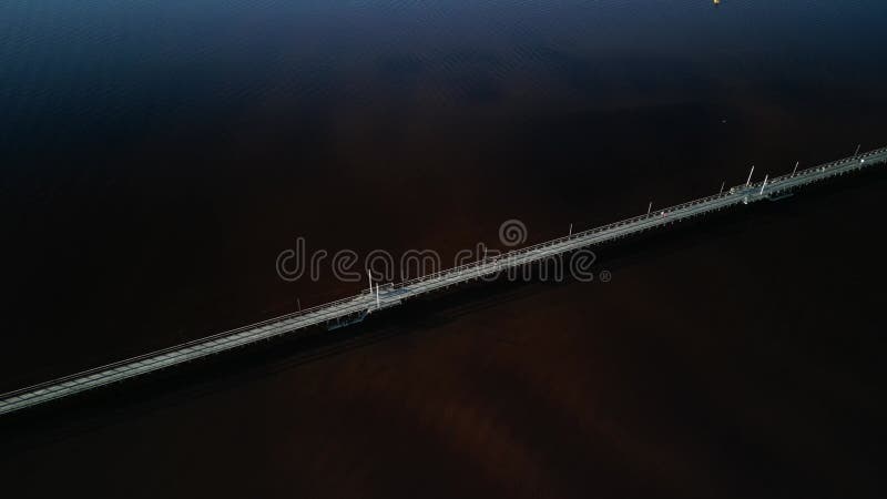 Aerial Slow Movement Around Long Bridge Surrounded by Water in Rattvik ...