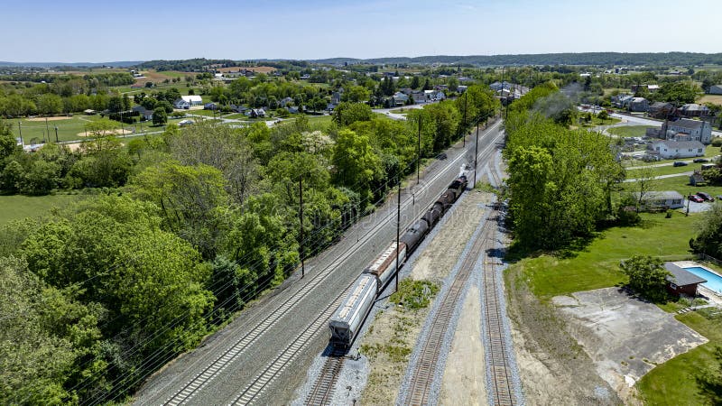 Aerial of a Steam Engine Moving Freight in Yard To Main Track Stock ...