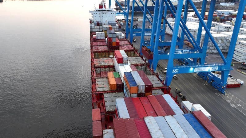 Aerial Timelapse of Cargo Ship Being Loaded and Unloaded in Port Stock ...