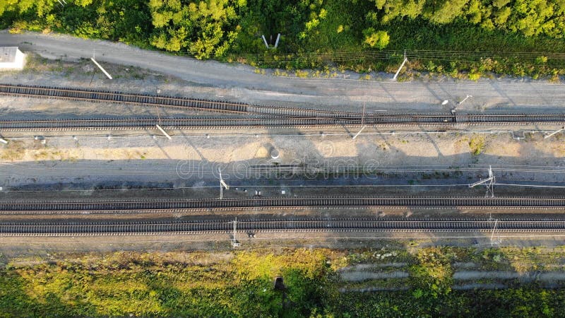 Aerial Top Down View of the Railway Along the Forest in Summer at ...