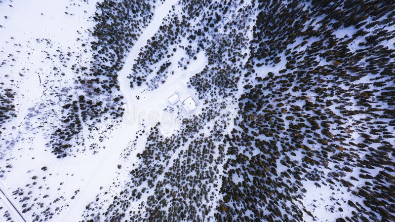 Aerial Top Down View of a House Covered in Snow in the Forest Stock ...