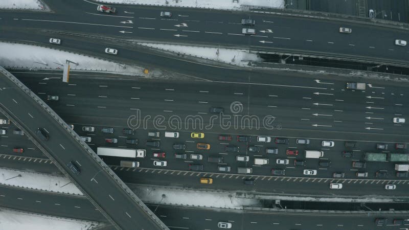 Aerial Top-down View of a Wide Highway and Traffic Jam in Falling Snow ...