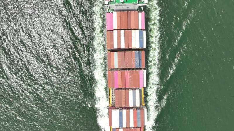 Container Ship Sailing through Calm Waters Under a Clear Sky with ...