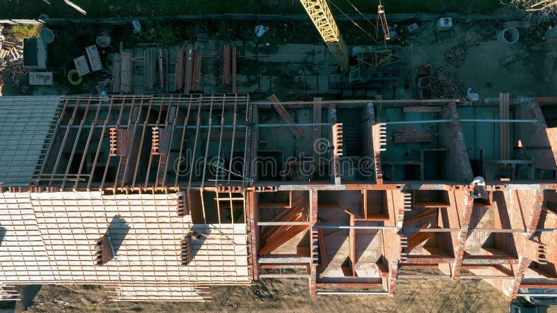 Aerial Top View Construction of a Cottage House. Builders Build a House ...