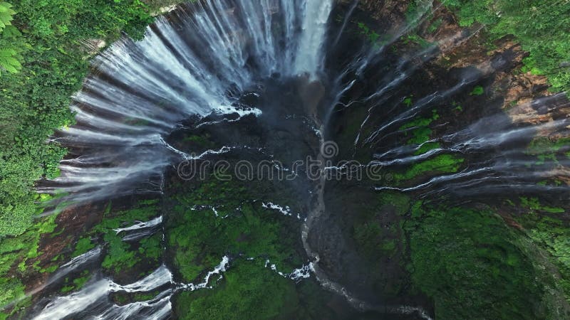 Aerial Top View Drone Rise Up and Spin from Bottom of Tumpak Sewu ...