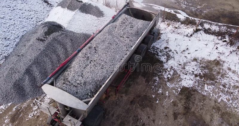 Aerial Top View of a Large Truck Unloading Rubble on a Construction ...