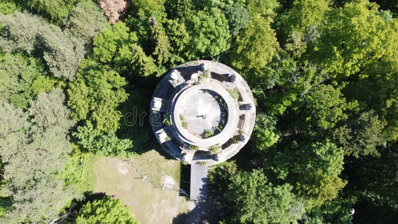 Aerial Top View of a Round Stone Castle Surrounded by Trees and ...