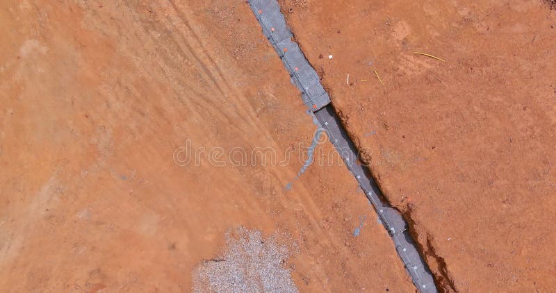 In Construction Site, Mason Levels Screeding Concrete for a Foundation ... In Construction Site, Mason Levels Screeding Concrete for a Foundation ...