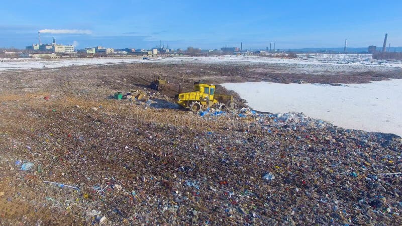 Aerial: Tractor Working at the Garbage Dump. Landfill, Garbage Dump ...