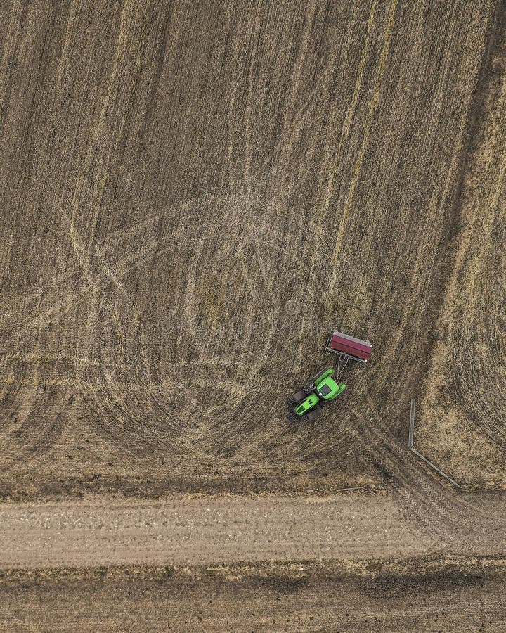 Aerial Vertical Shot of a Tractor Cultivating a Large Field Stock Image ...