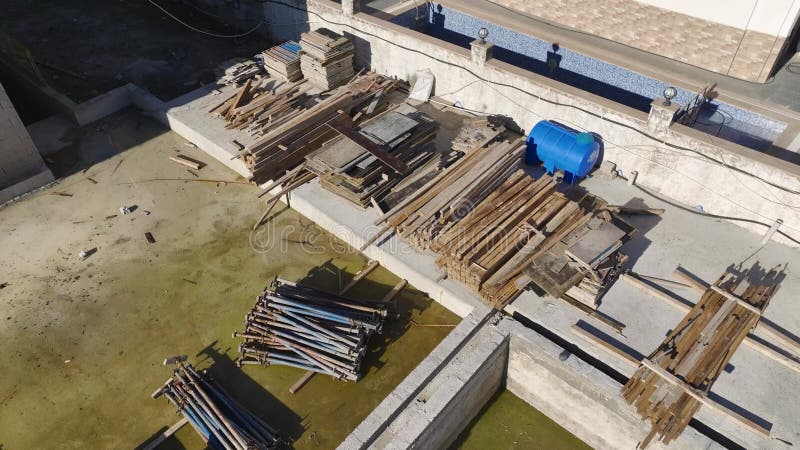 Aerial Video of an Active Construction Zone with Concrete Mixers, Steel ...